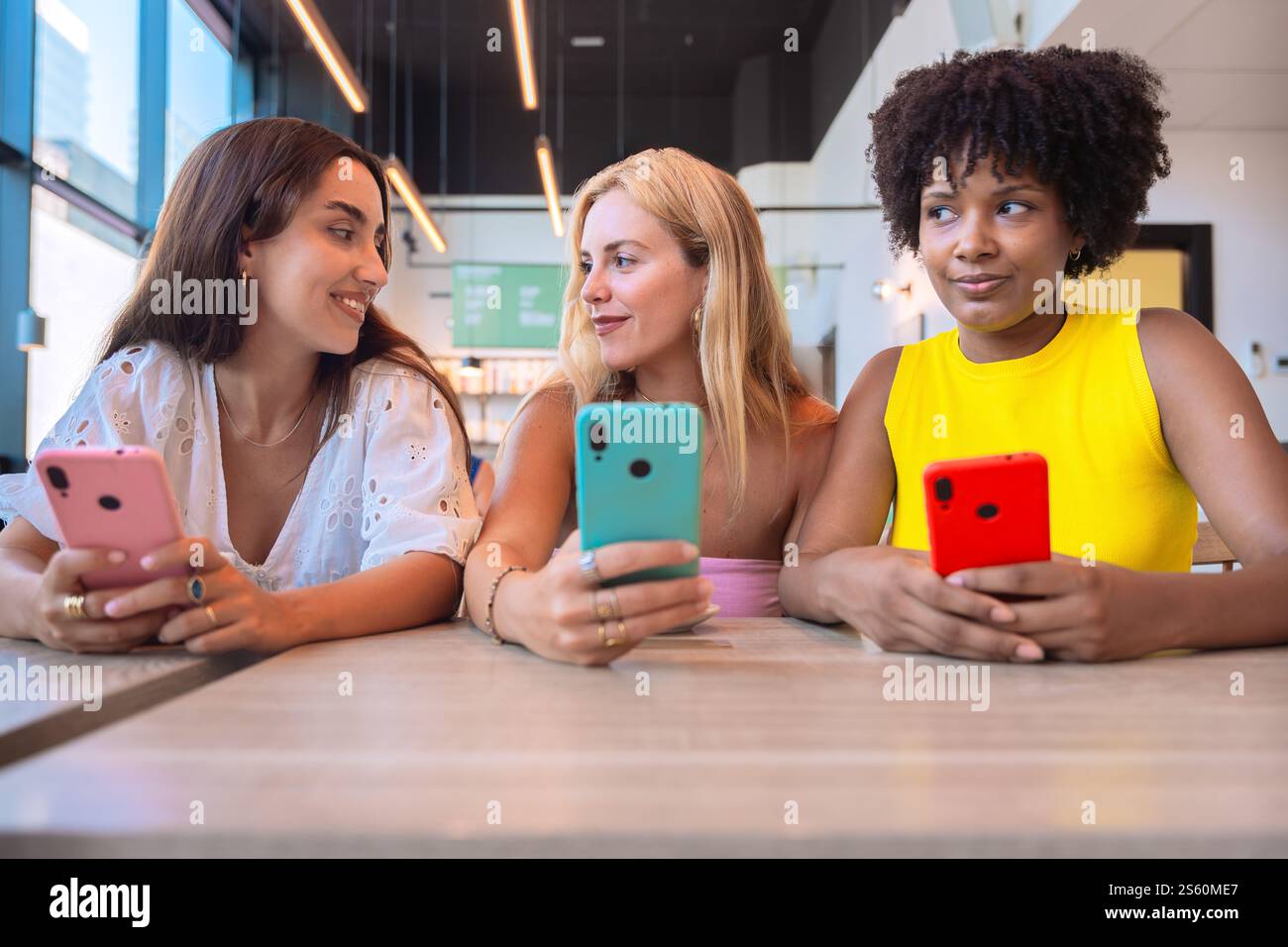 Group friends sitting in cafe hi-res stock photography and images - Alamy
