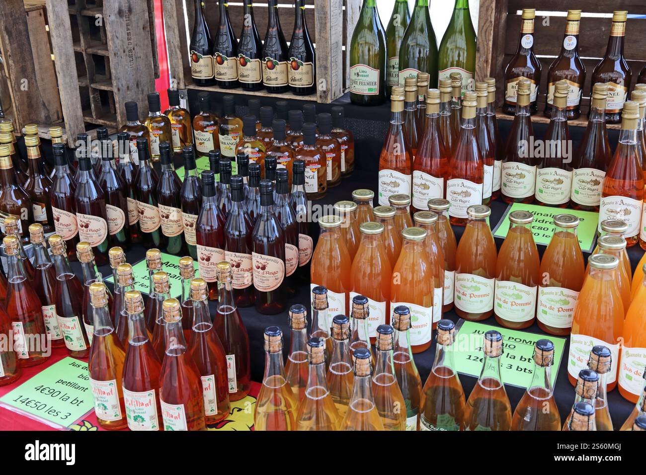 Bottles of apple based drinks on market stall, Honfleur Stock Photo - Alamy