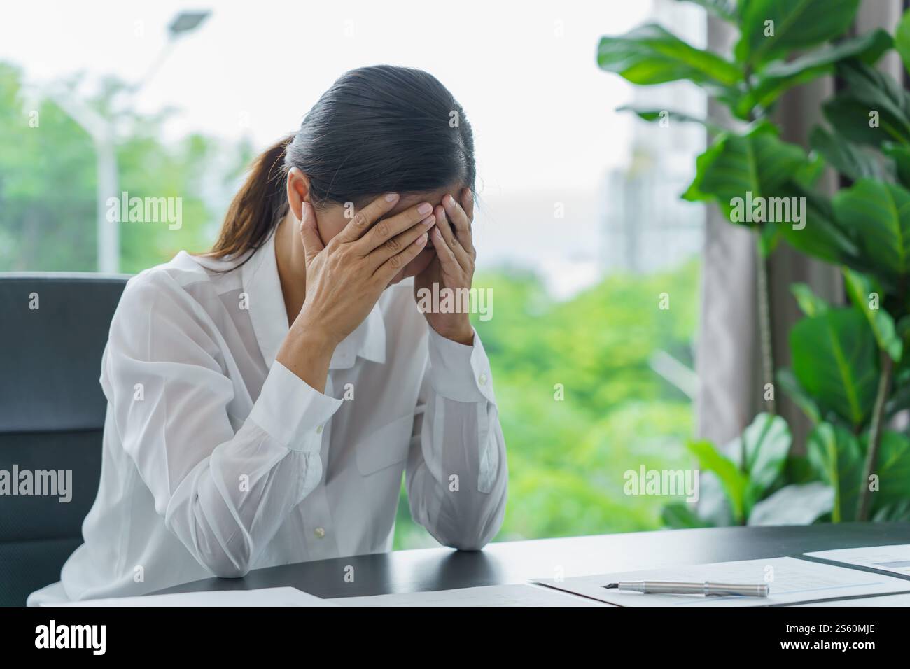 Burnout concept. Asian Business woman touching forehead having headache ...