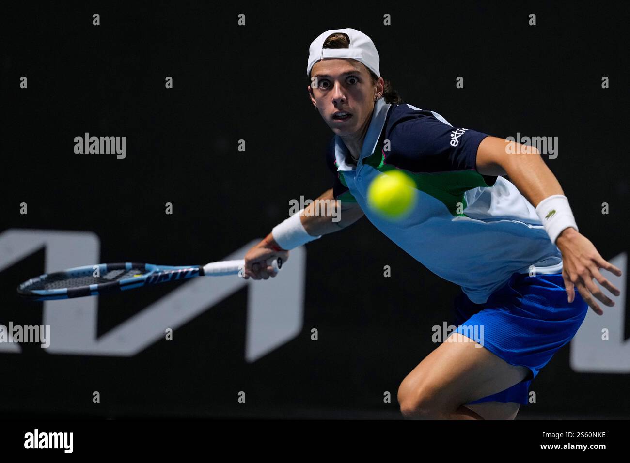 Arthur Cazaux of France plays a forehand return to Jacob Fearnley of ...