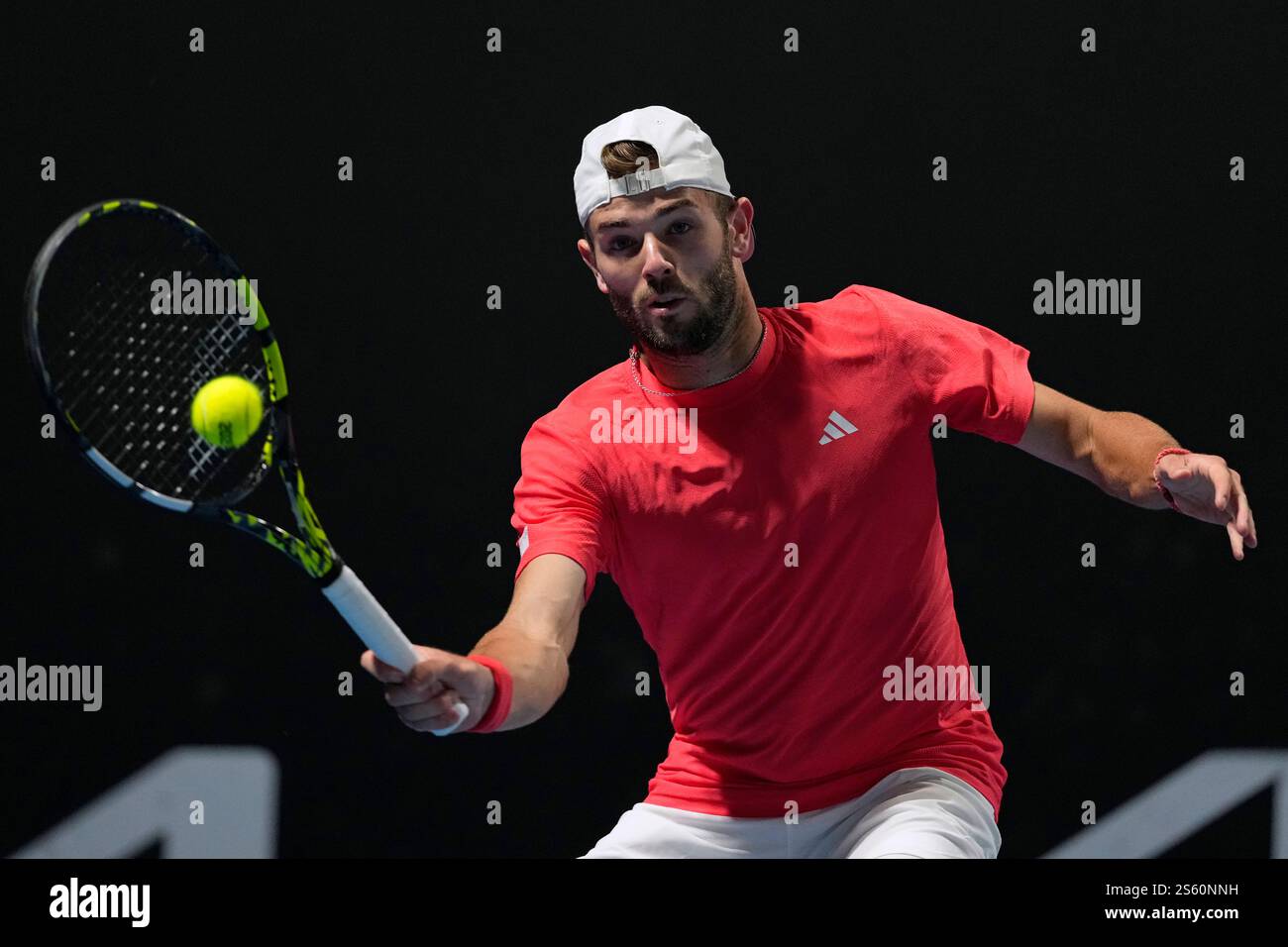 Jacob Fearnley of Britain plays a forehand return to Arthur Cazaux of ...