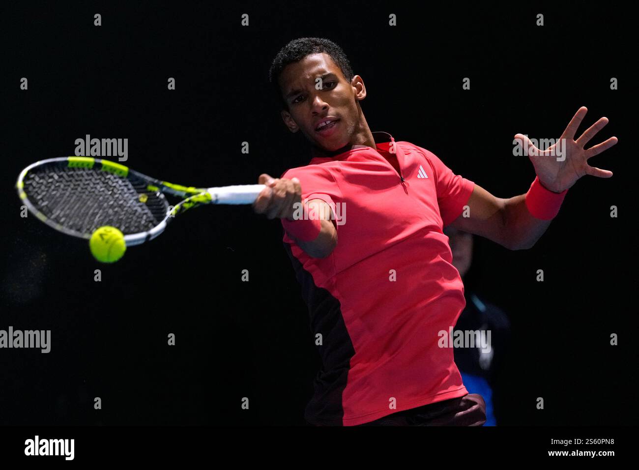 Felix Auger-Aliassime of Canada plays a forehand return to Alejandro Davidovich Fokina of Spain ...