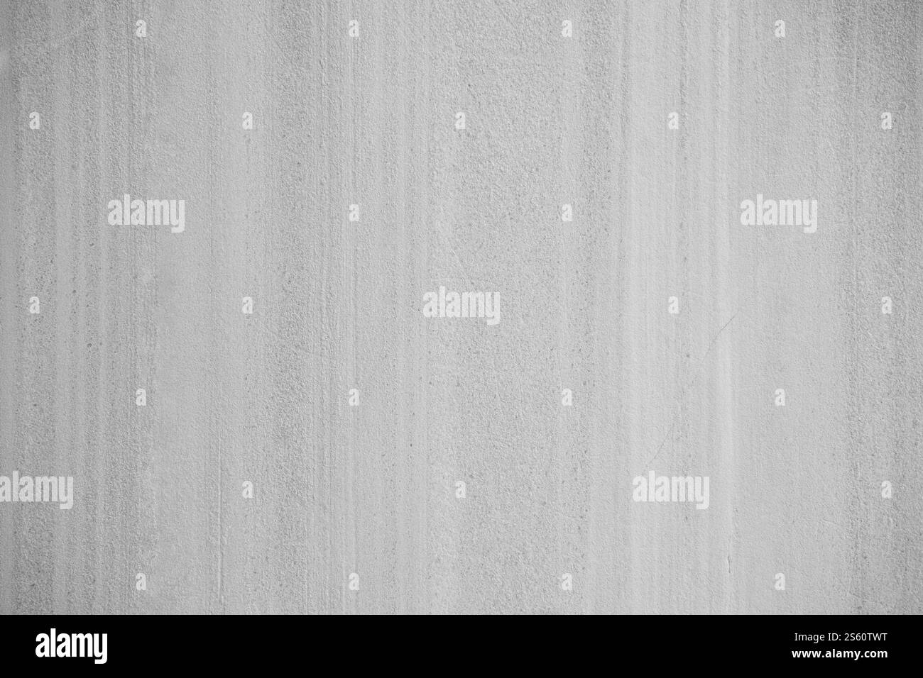 A clean white concrete wall showing vertical textures and subtle ...