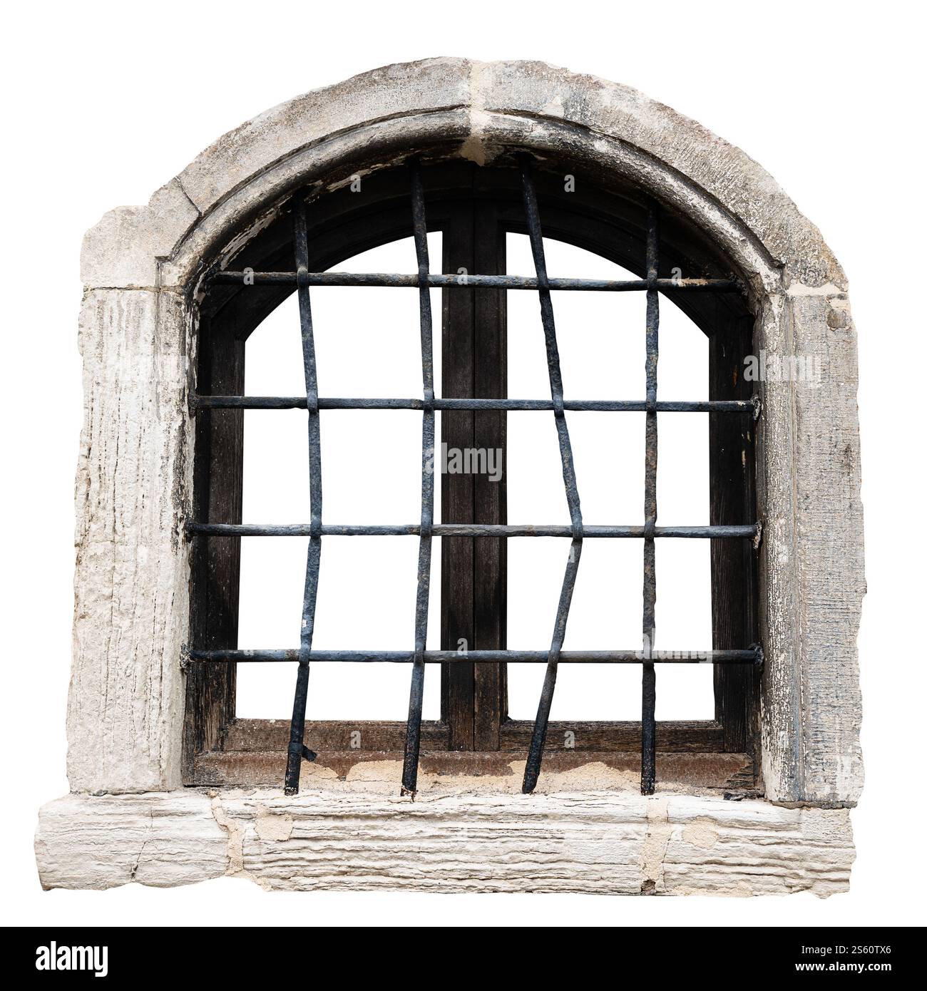 A rustic arched window with iron bars surrounded by a stone frame ...