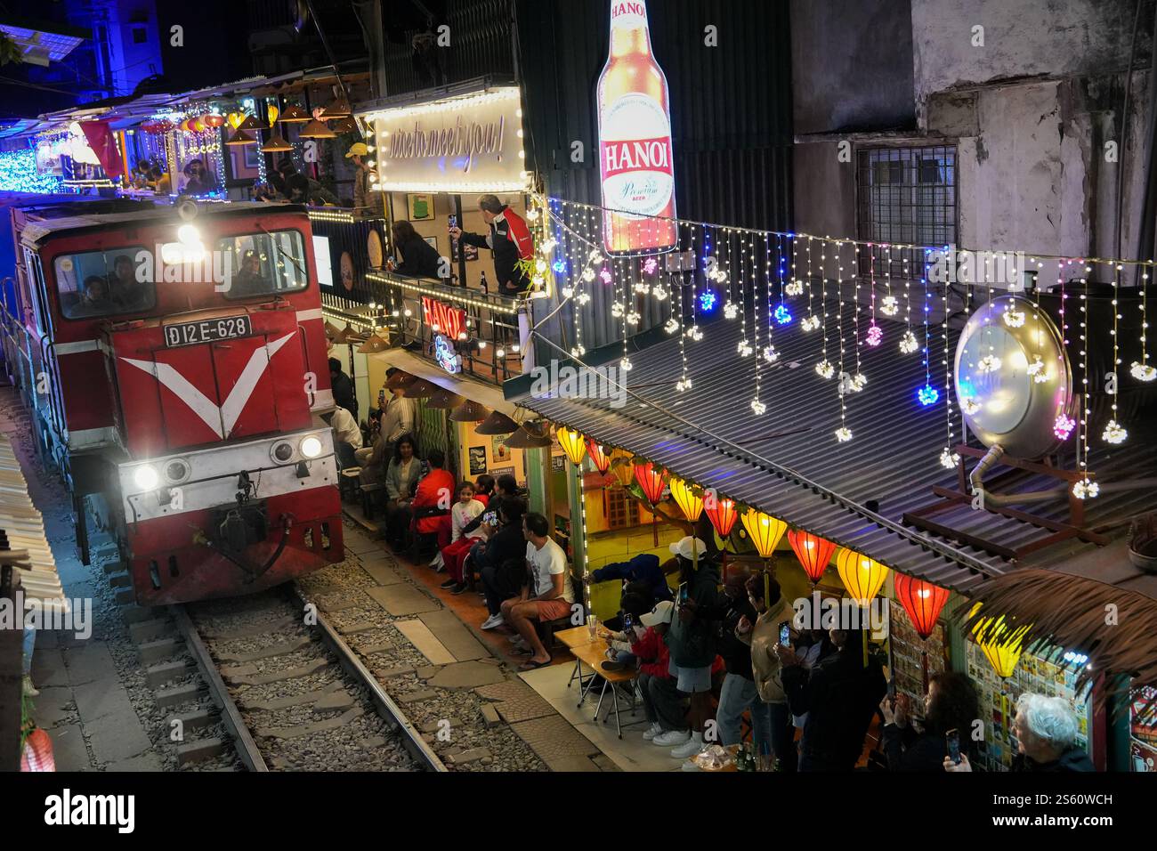 A locomotive pulls into the Train Street at the Old Quarter of Hanoi in ...