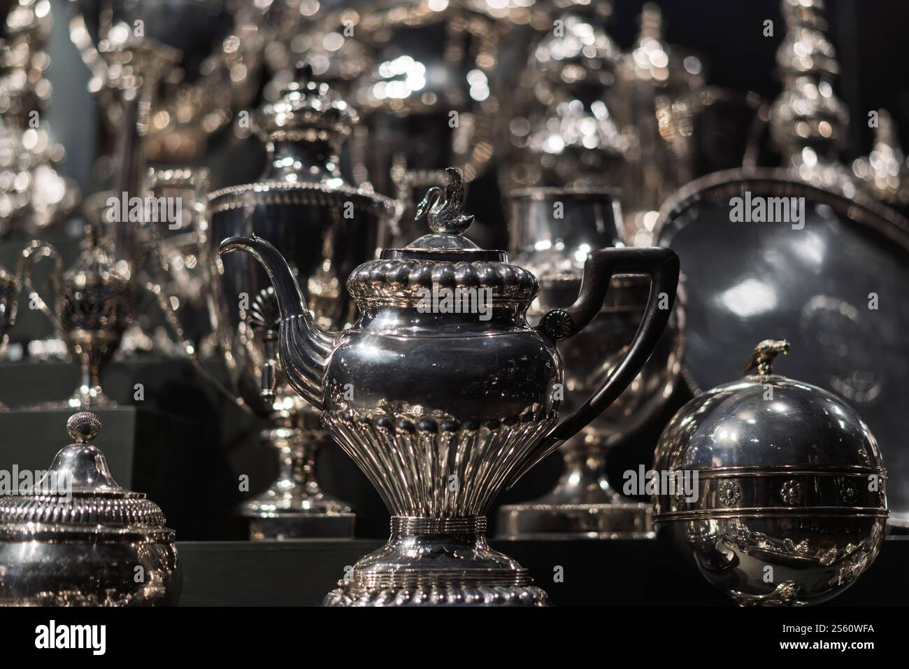 An elegant vintage silverware collection with polished finishes and ...