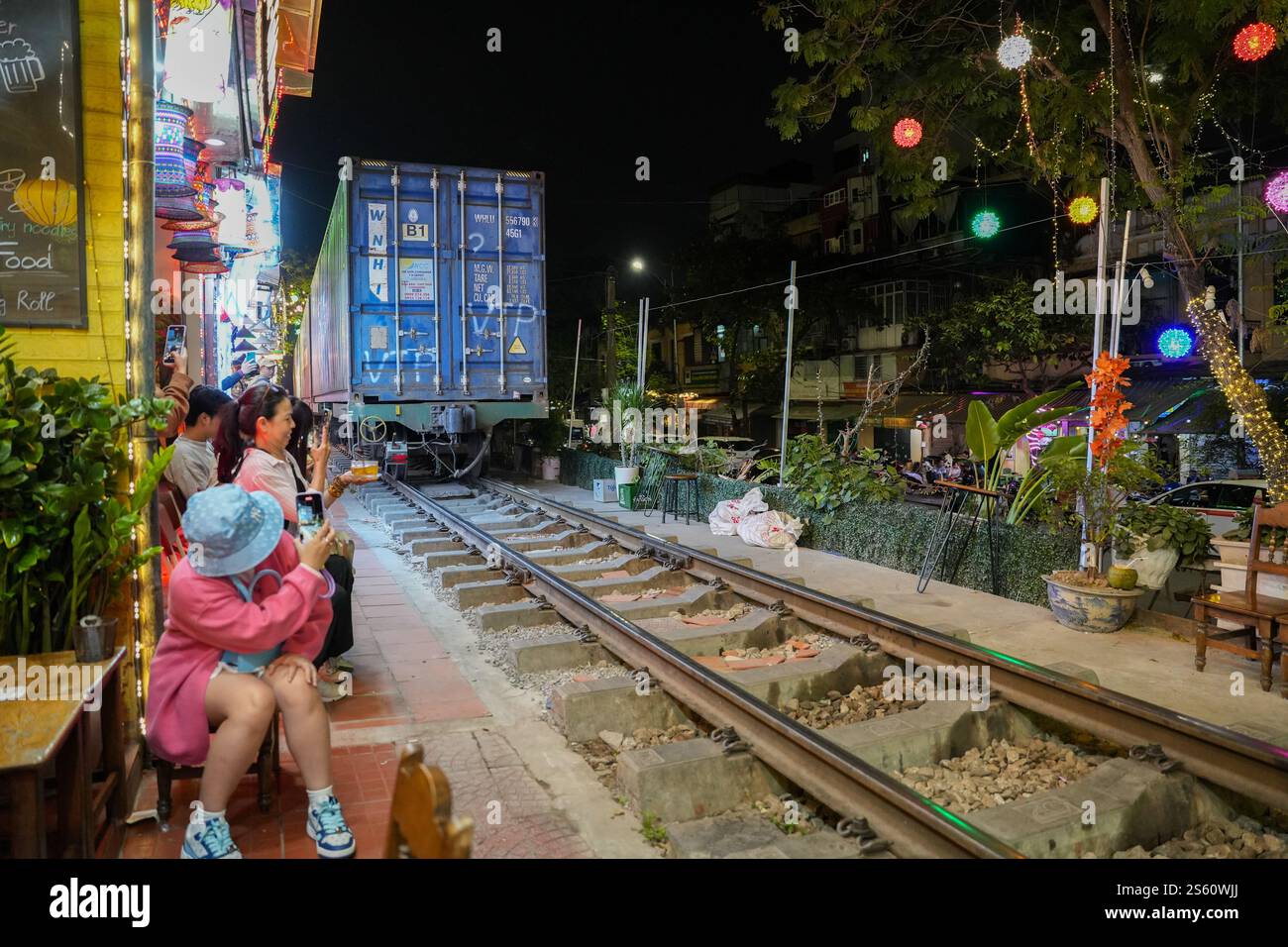 A locomotive pulls into the Train Street at the Old Quarter of Hanoi in ...