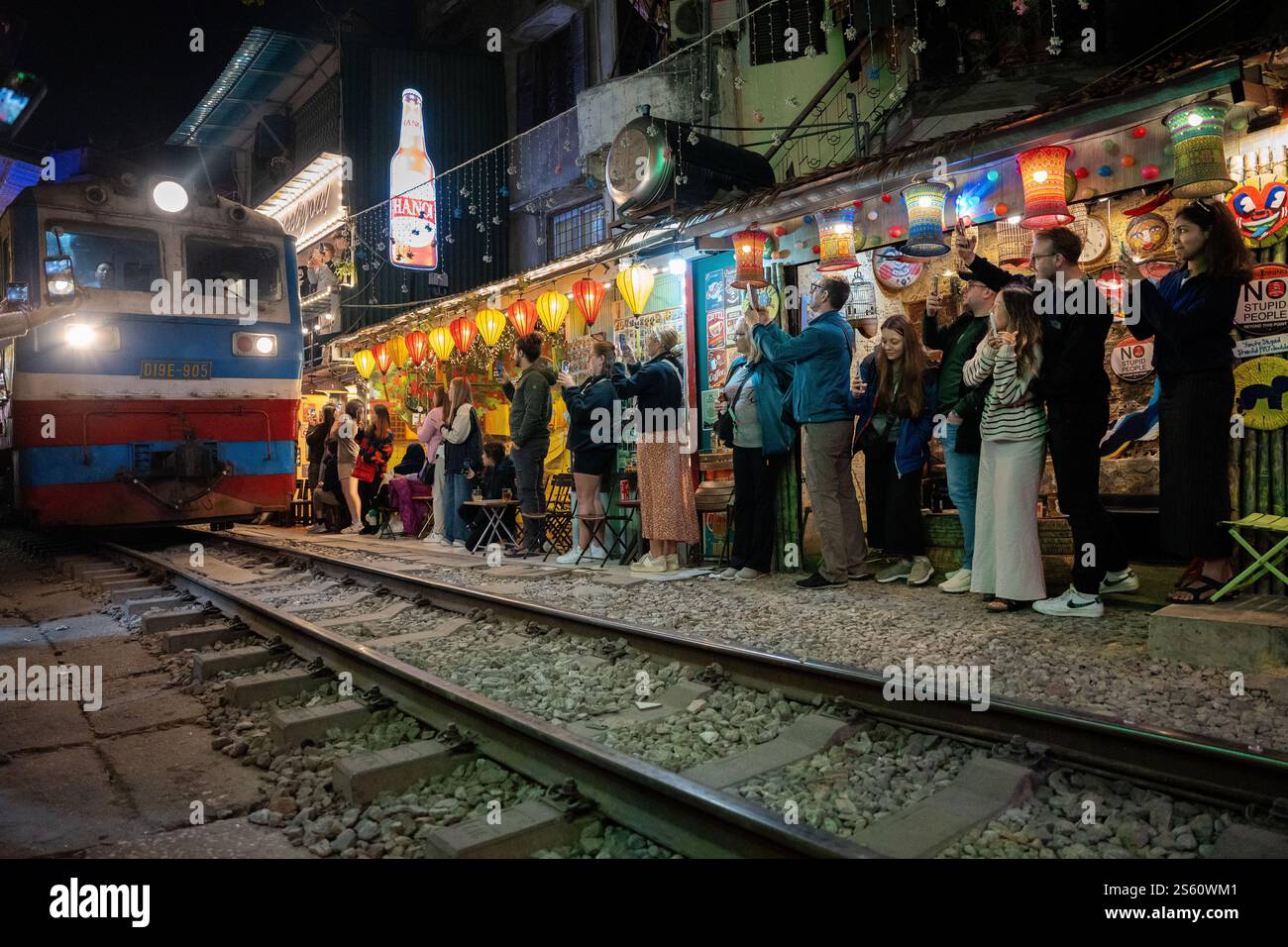 A locomotive pulls into the Train Street at the Old Quarter of Hanoi in ...