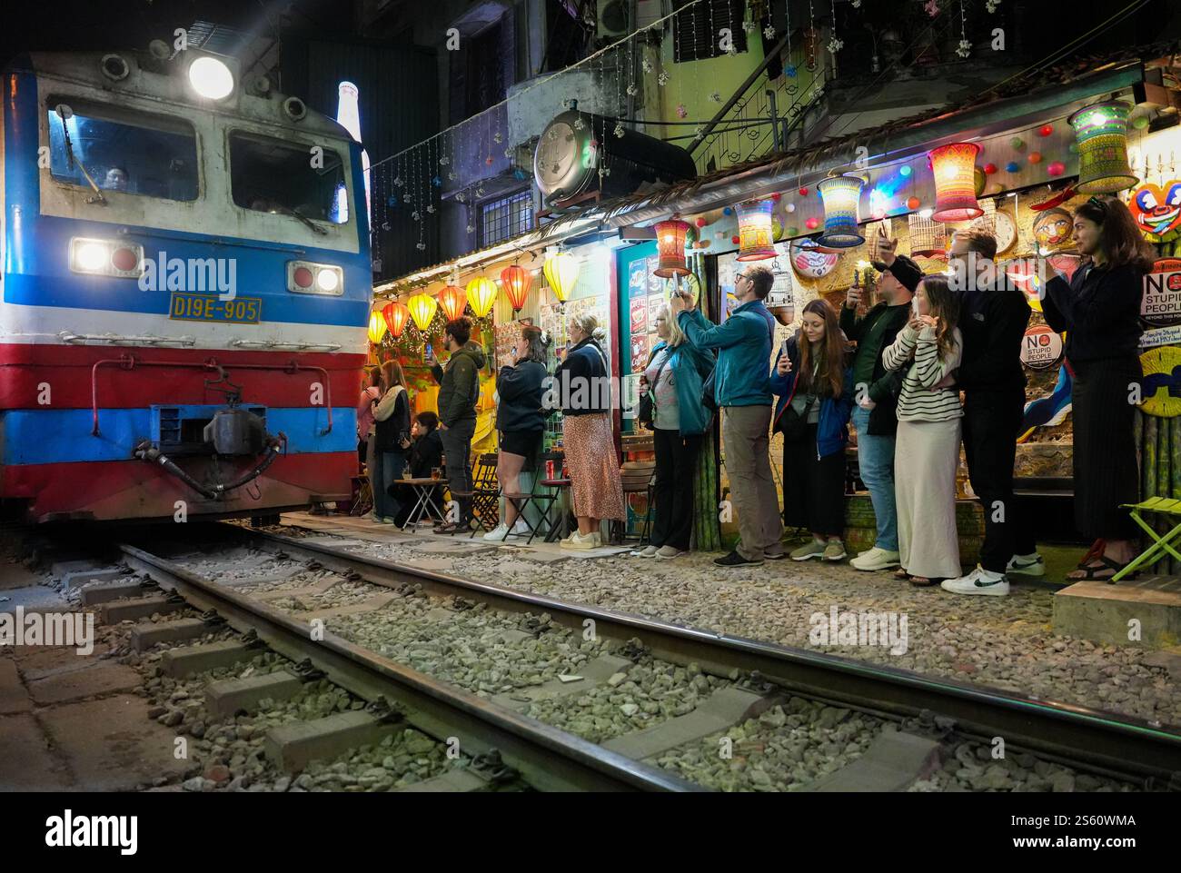 A locomotive pulls into the Train Street at the Old Quarter of Hanoi in ...