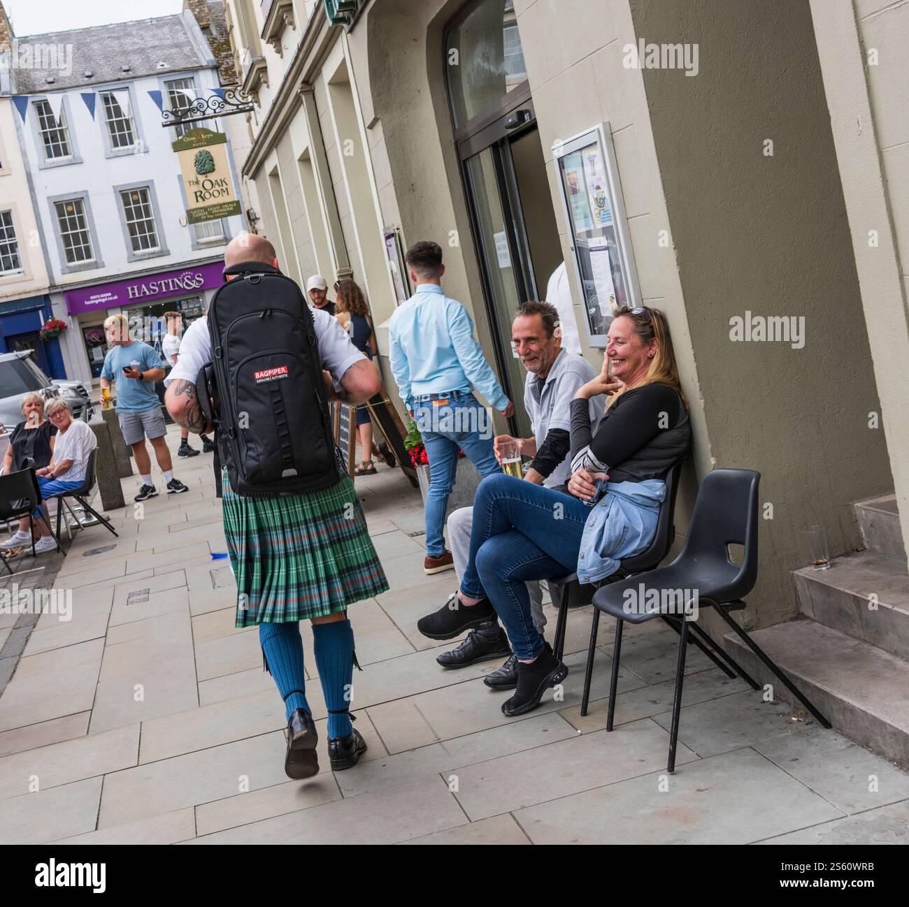 Piper with kilt, pipes in backpack, heads for a music session in Kelso ...