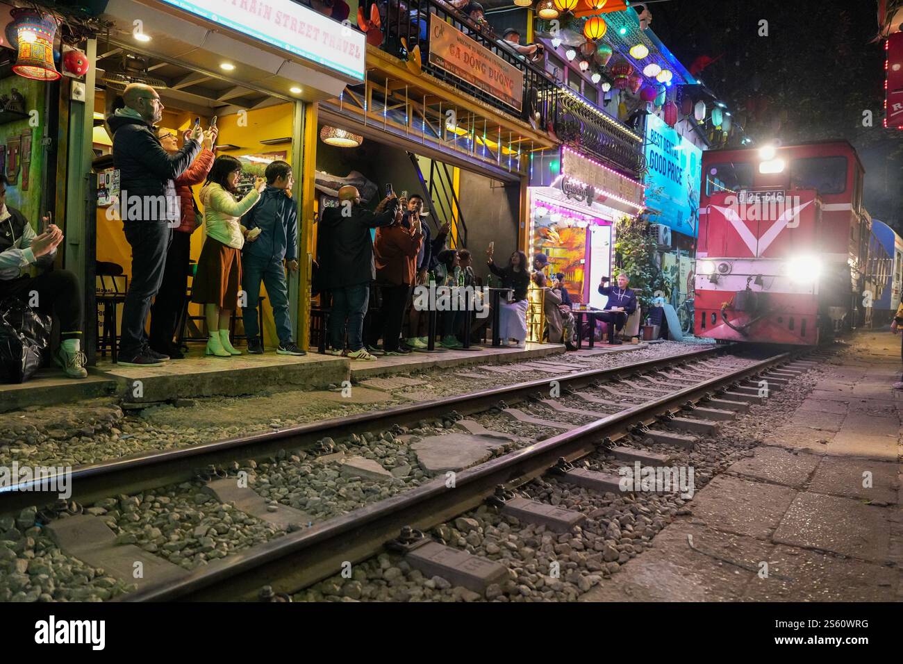 A locomotive pulls into the Train Street at the Old Quarter of Hanoi in ...