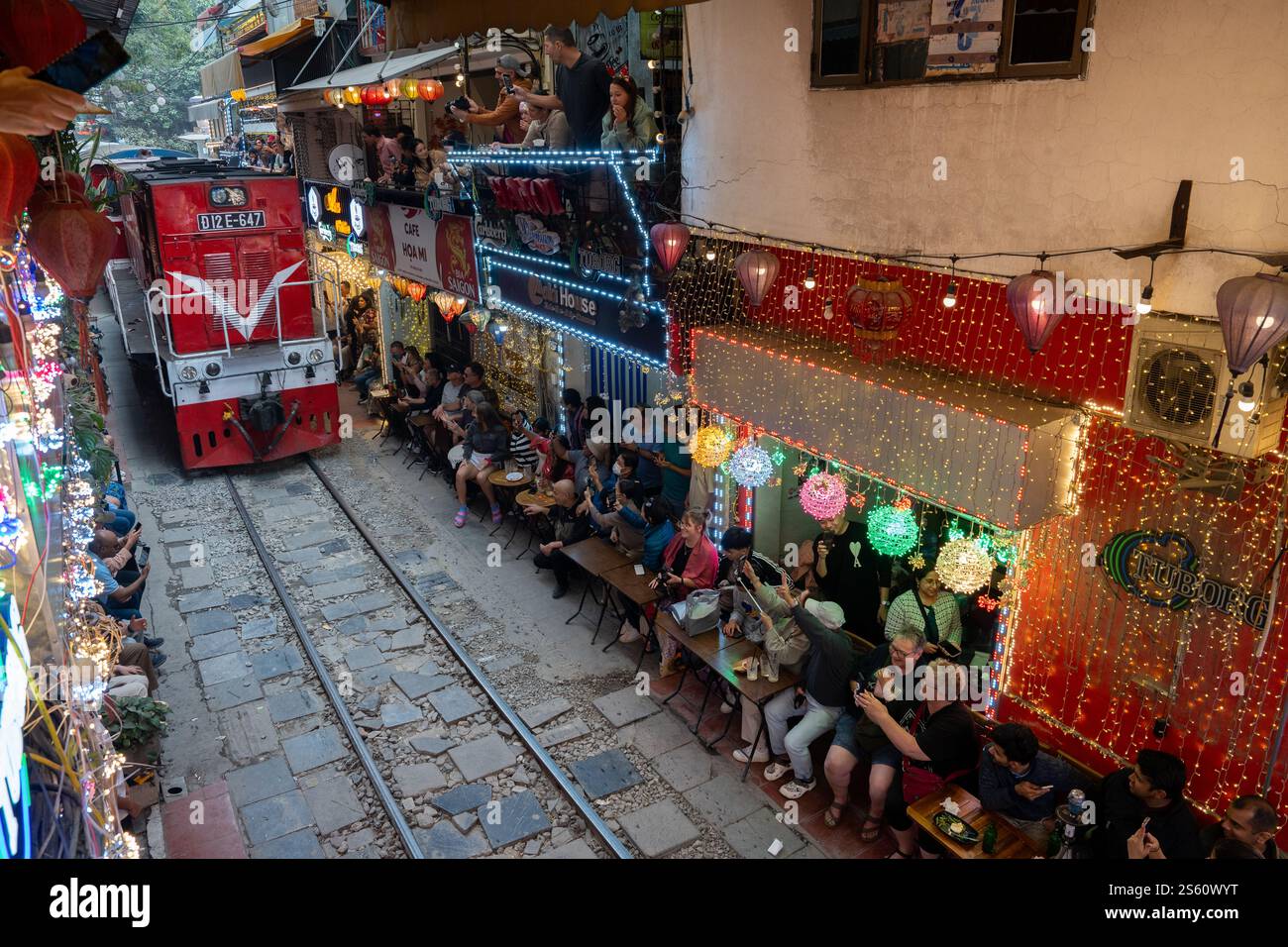 A locomotive pulls into the Train Street at the Old Quarter of Hanoi in ...