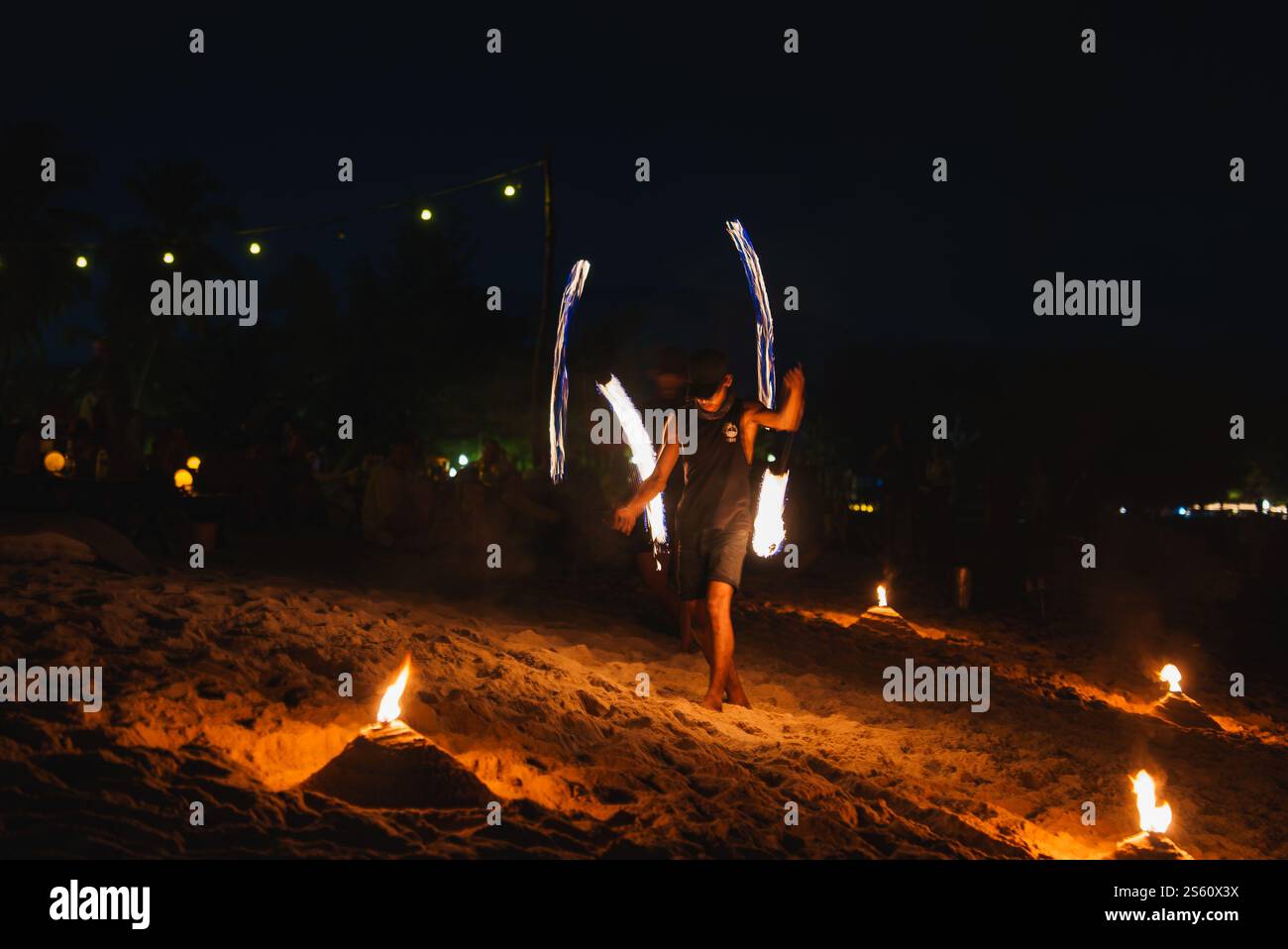 Fire Performer Spinning Flames on a Tropical Beach at Night Stock Photo ...