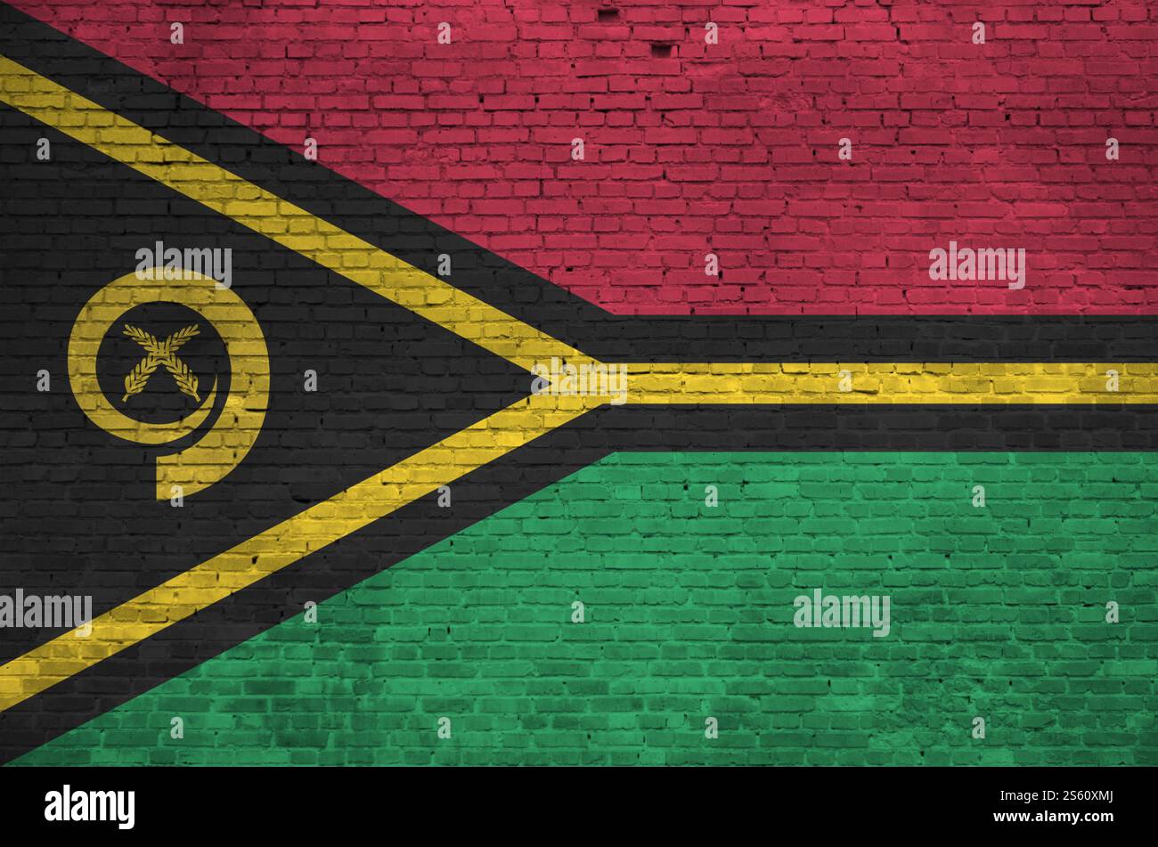 Vanuatu flag depicted in paint colors on old brick wall close up ...
