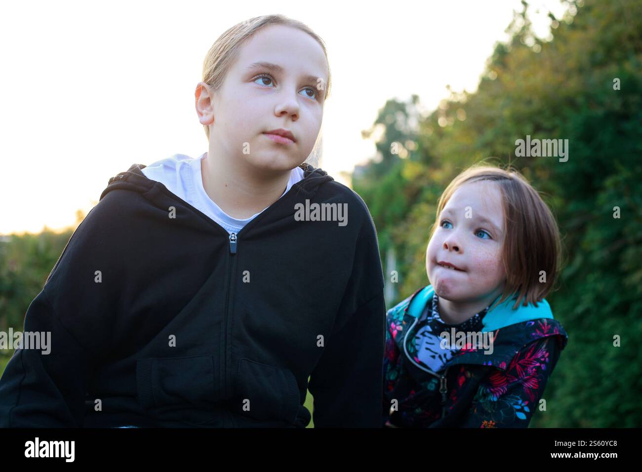 Funny young little girls playing in the park outdoors. Best friend kids ...