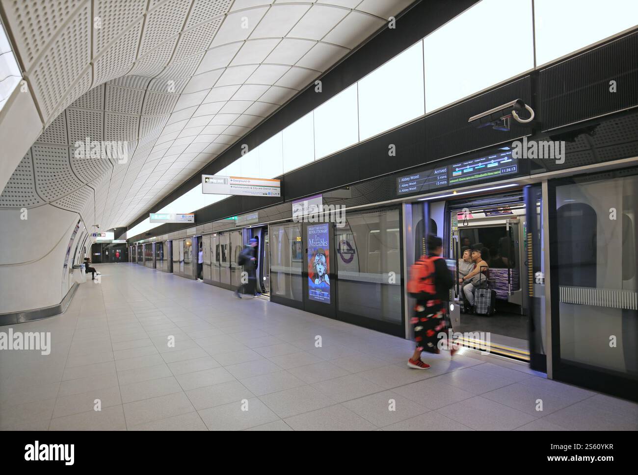 Passengers board an Elizabeth Line train at the new Whitechapel Station ...