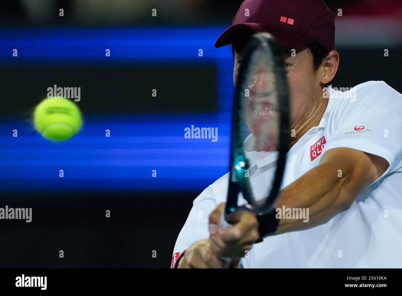 Kei Nishikori of Japan plays a backhand return to Tommy Paul of the U.S ...
