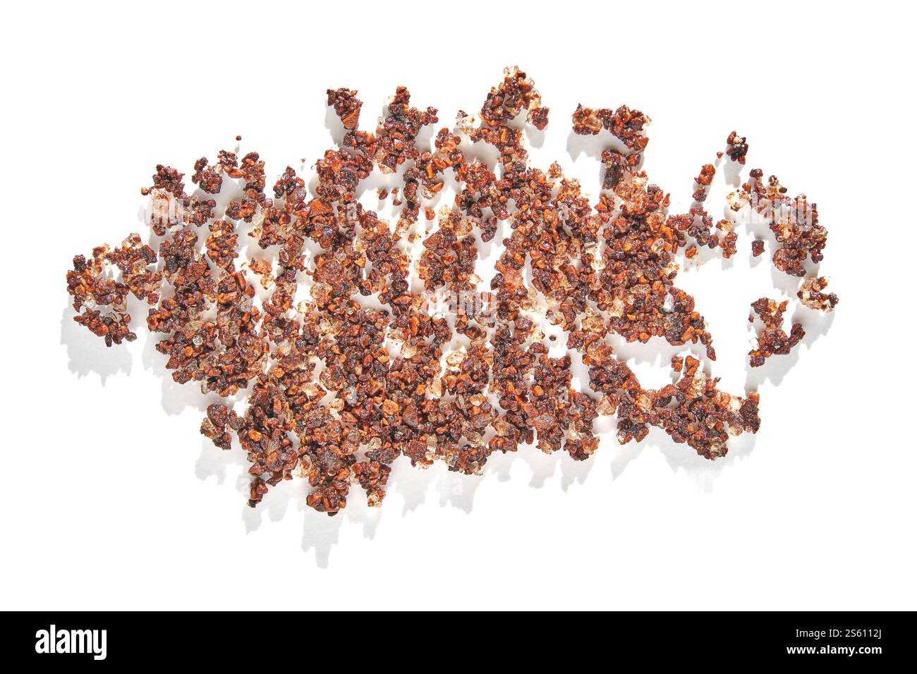 Roasted brown buckwheat groats forming an intricate pattern on white ...