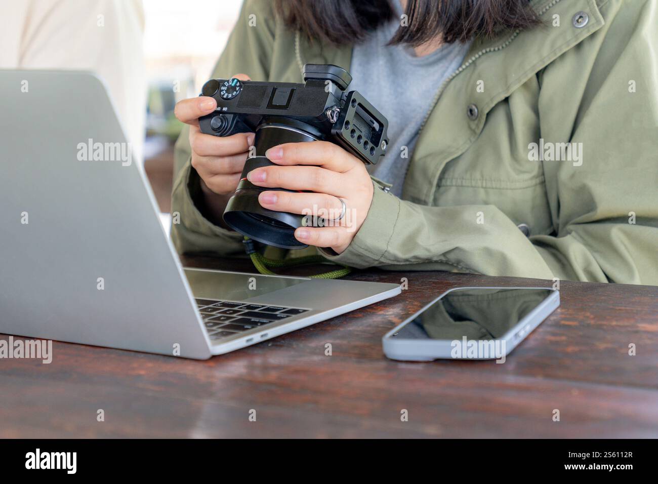 female checking a picture on digital camera Stock Photo - Alamy