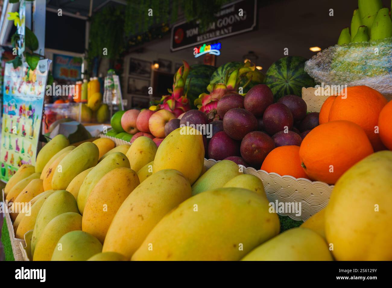 Colorful Tropical Fruit Stand in a Bustling Thai Market Setting Stock ...