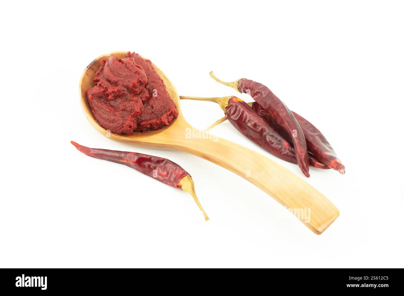Traditional turkish chili pepper paste in spoon with dried peppers ...