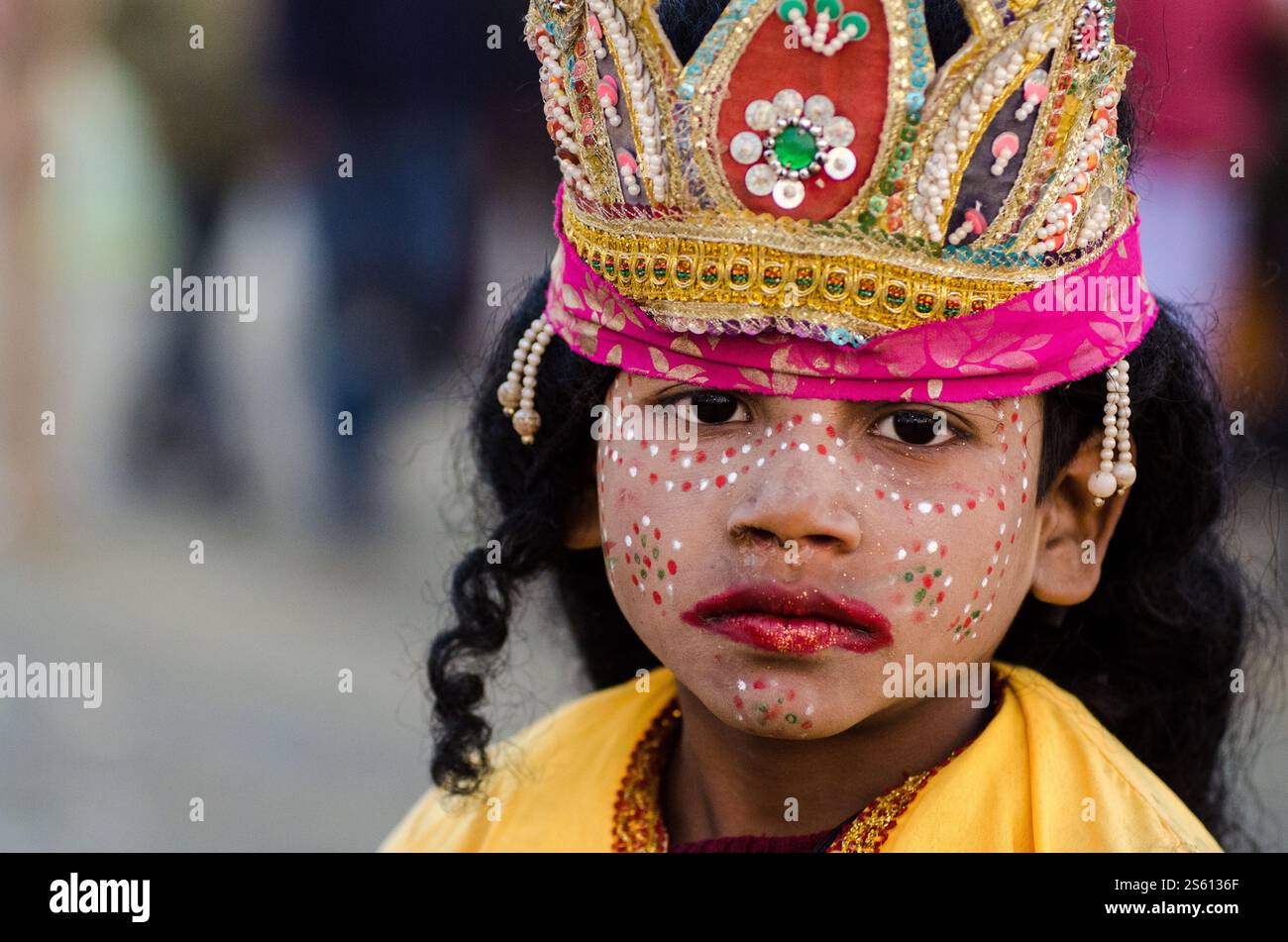 Girl with traditional makeup at a cultural festival among gathering ...