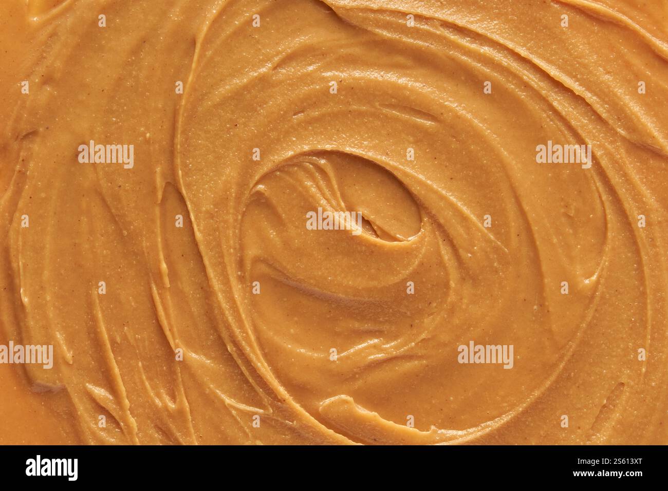 Smooth creamy peanut butter texture with swirls and rich nutty color ...
