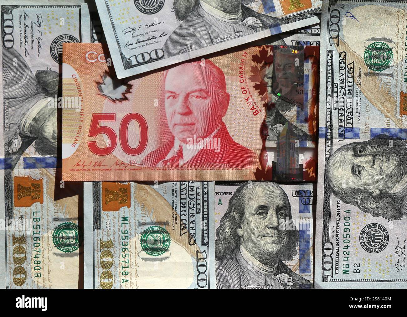 Fifty Canadian and Hundred US Dollar banknote Background Stock Photo ...