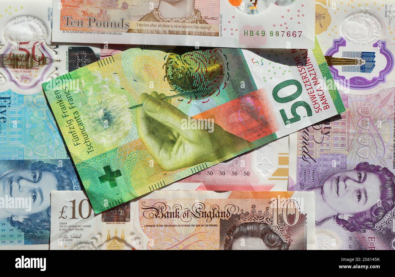 British Pound with Queen and Fifty Swiss Franc Banknotes Stock Photo ...