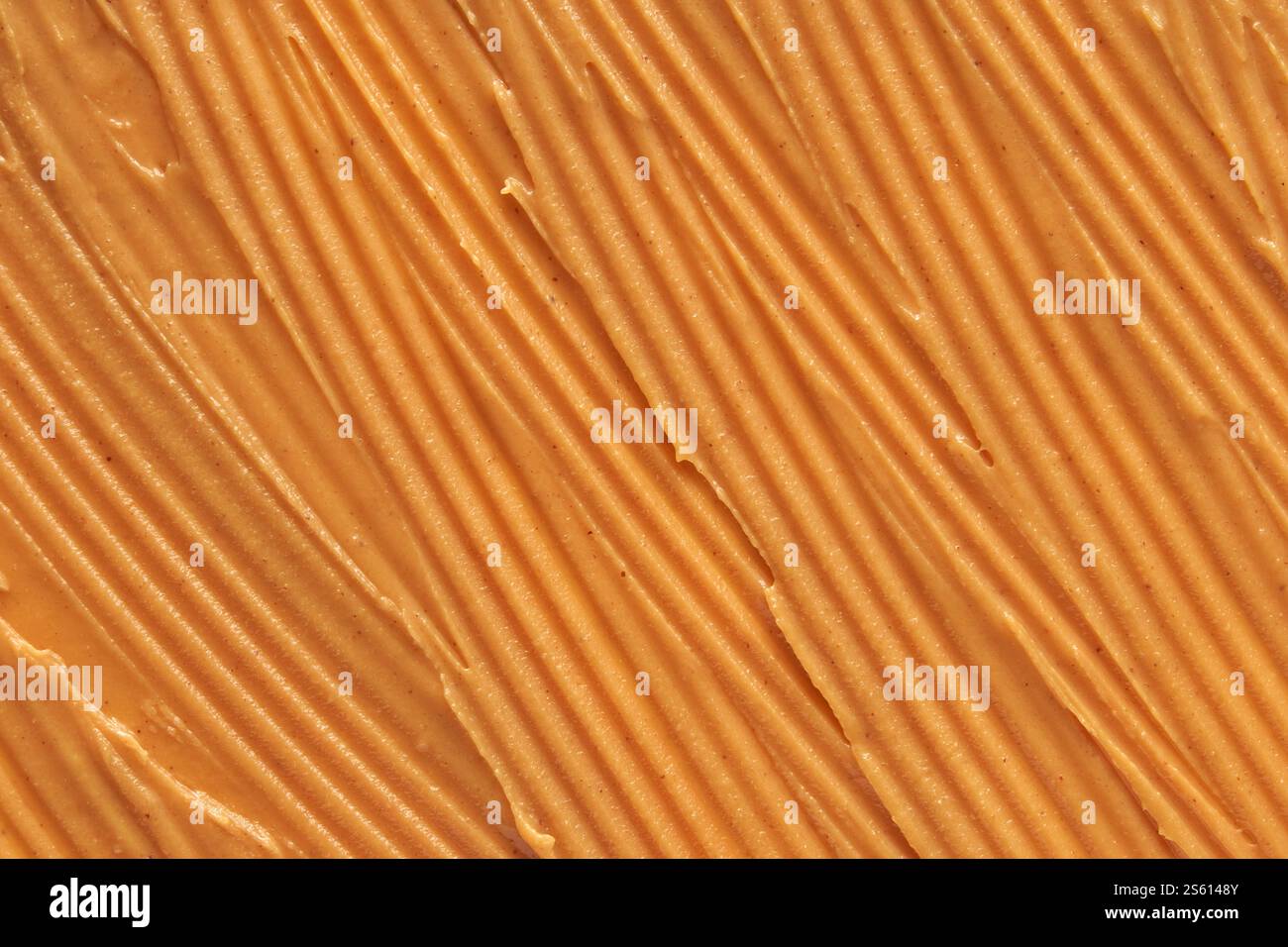 Smooth peanut butter texture with evenly spread creamy surface ...
