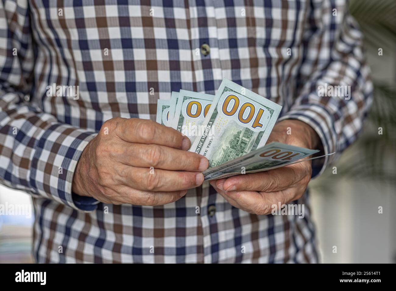 Hands collecting american dollar bills hi-res stock photography and ...