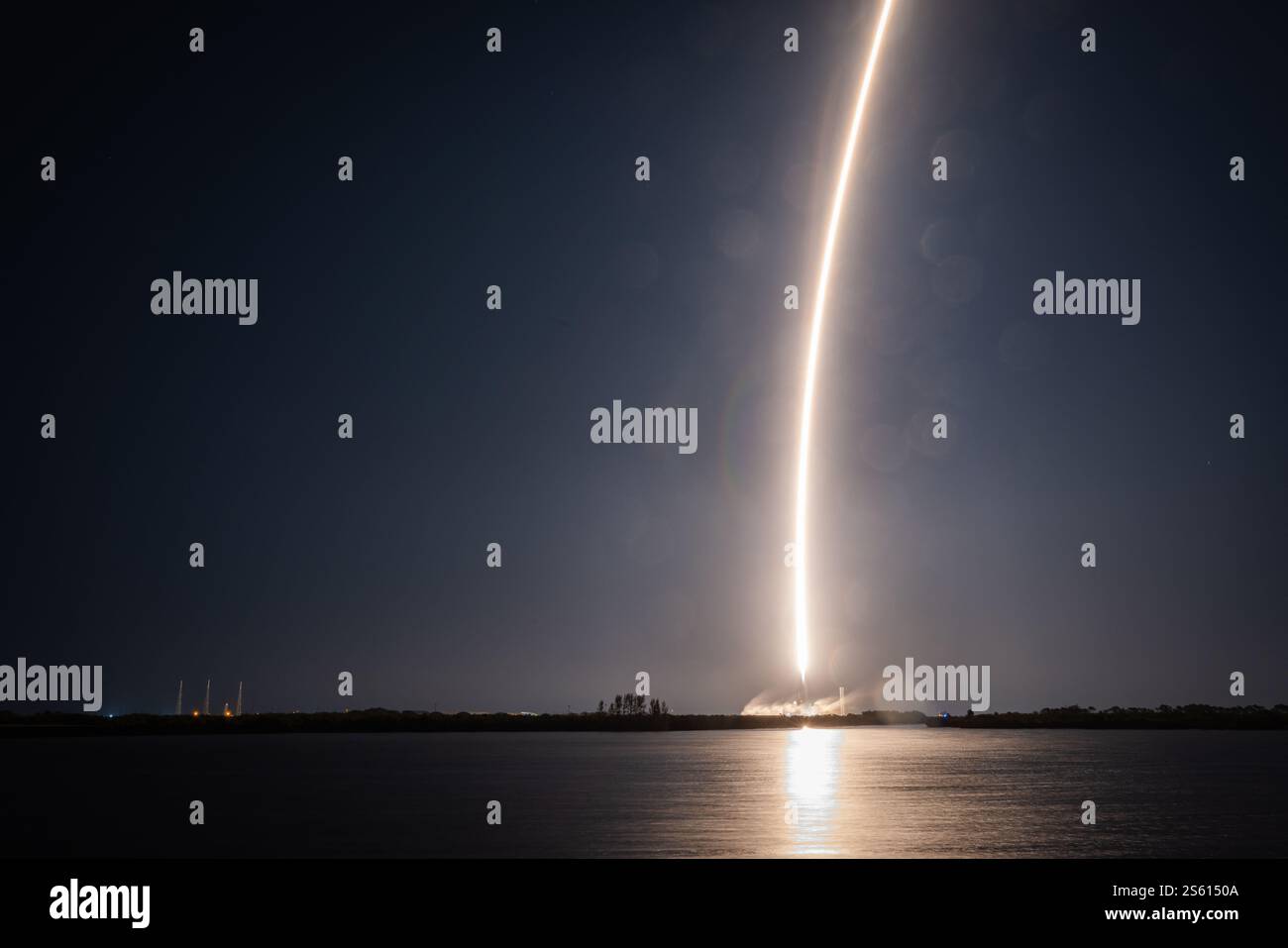 Handout photo show Creating a golden streak in the night sky, a SpaceX ...