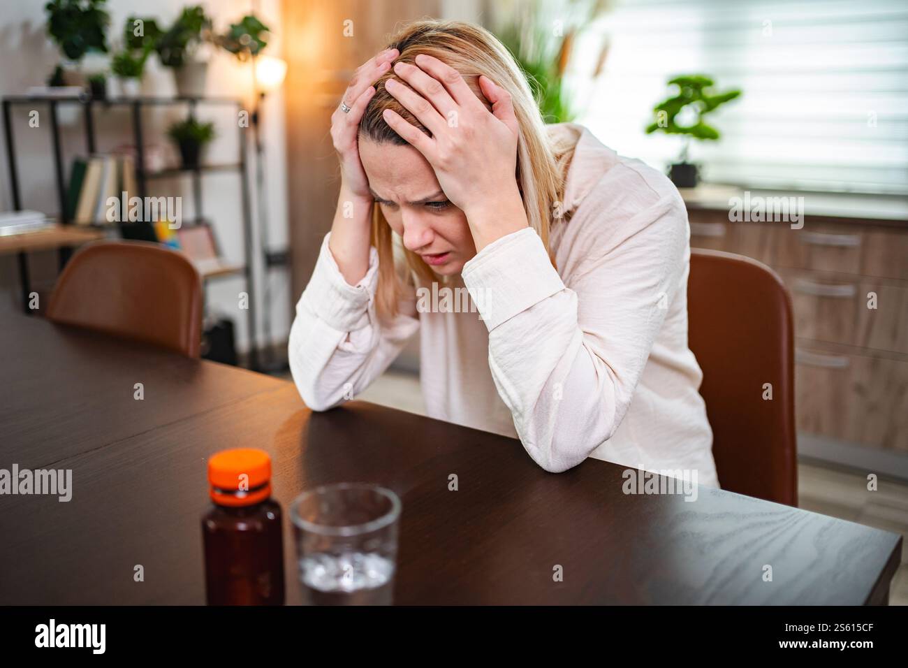 Struggling with inner turmoil in a calm kitchen setting Stock Photo - Alamy