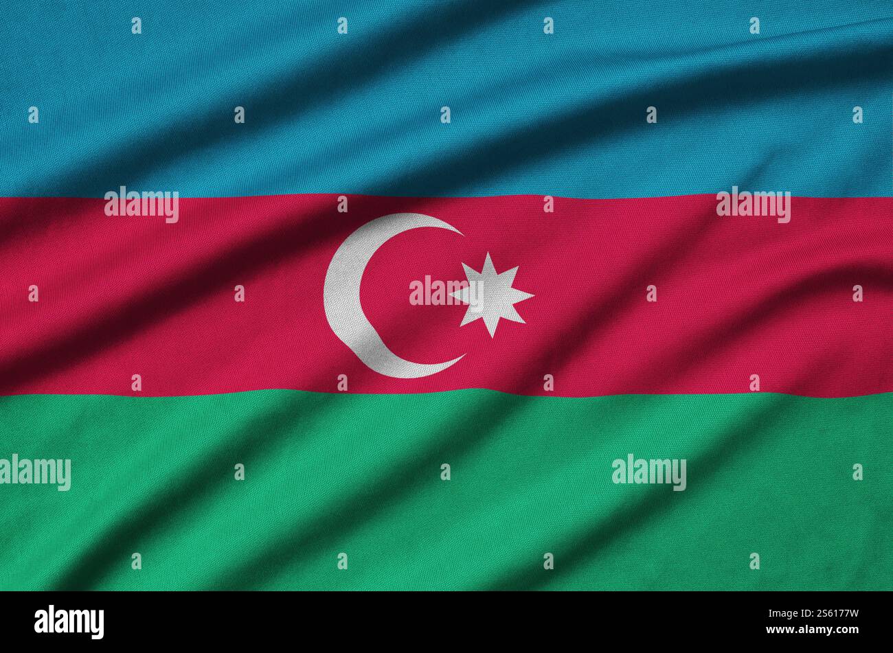 Azerbaijan flag is depicted on a sports cloth fabric with many folds ...