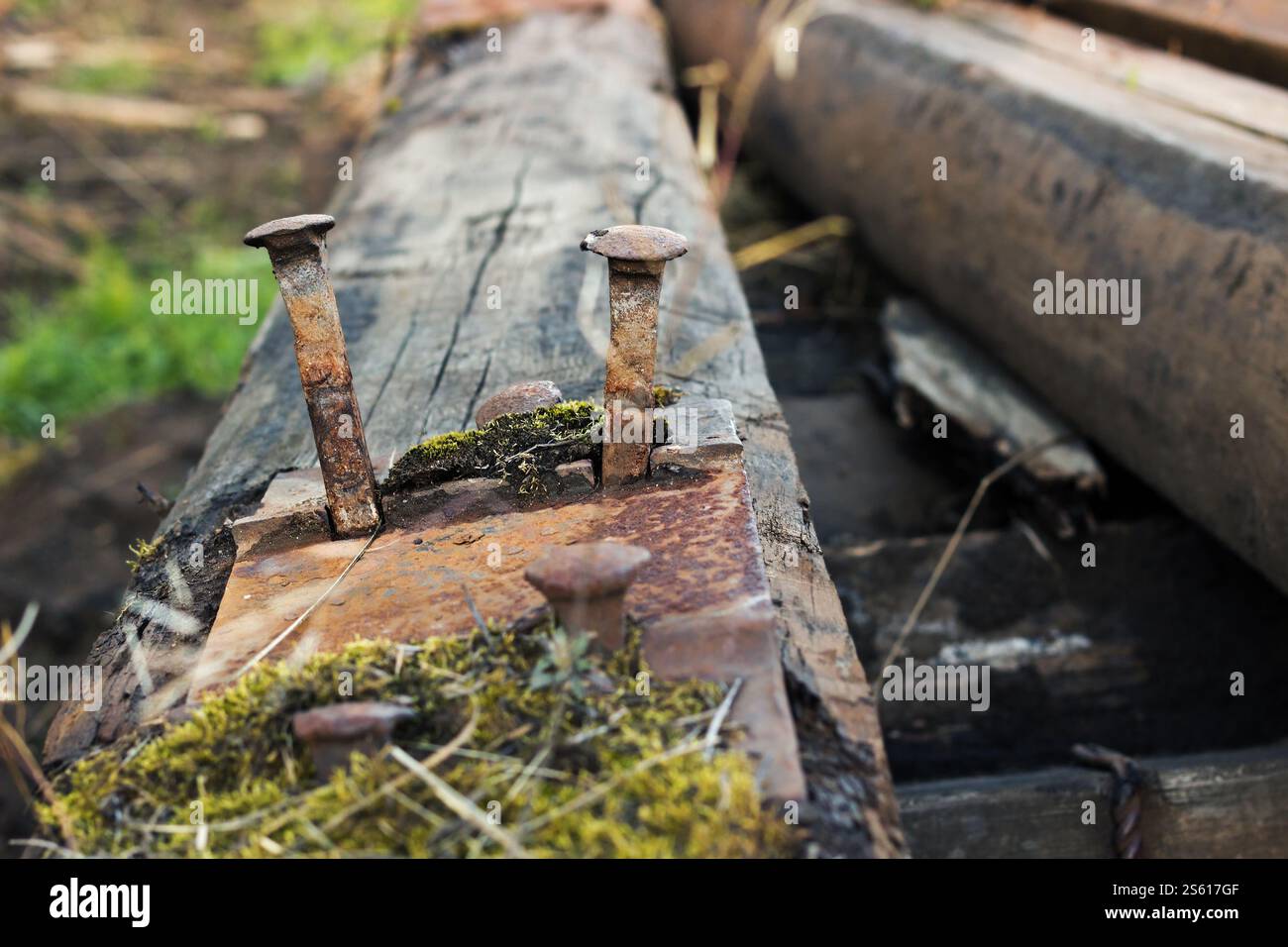 Rusty iron bolts in old wooden sleeper of damaged railway Stock Photo ...