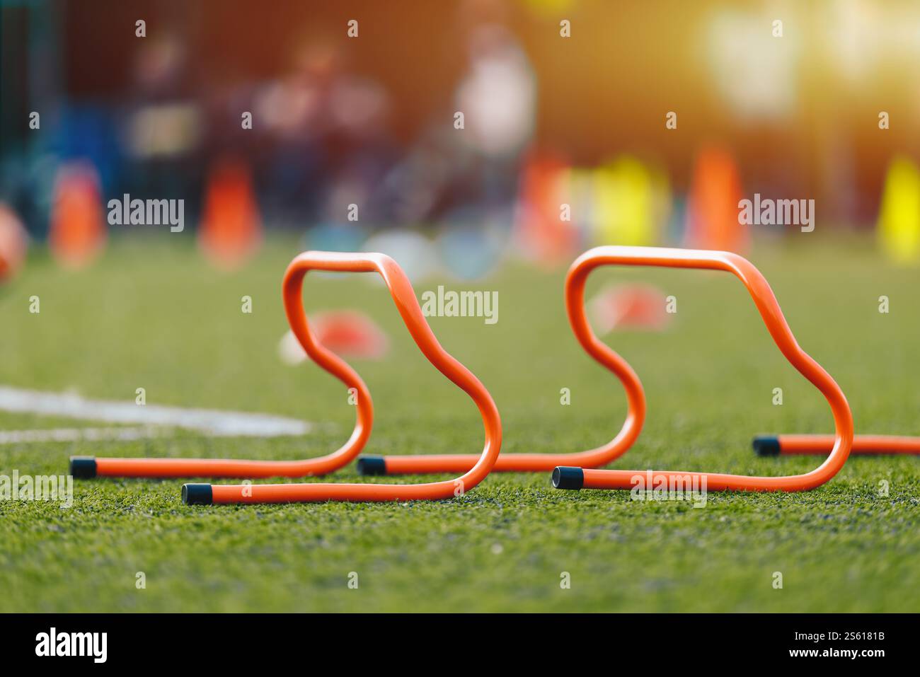 Soccer Hurdles Training Equipment on Grass Pitch. Footballers in ...