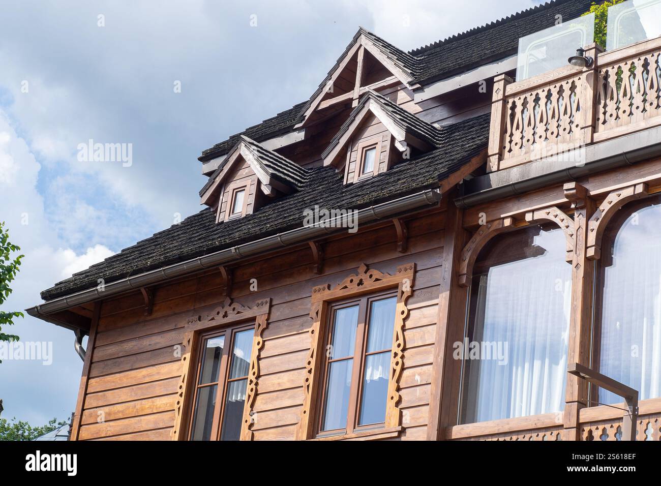 Old wooden house. Exterior facade balcony. Exterior facade windows. Old ...