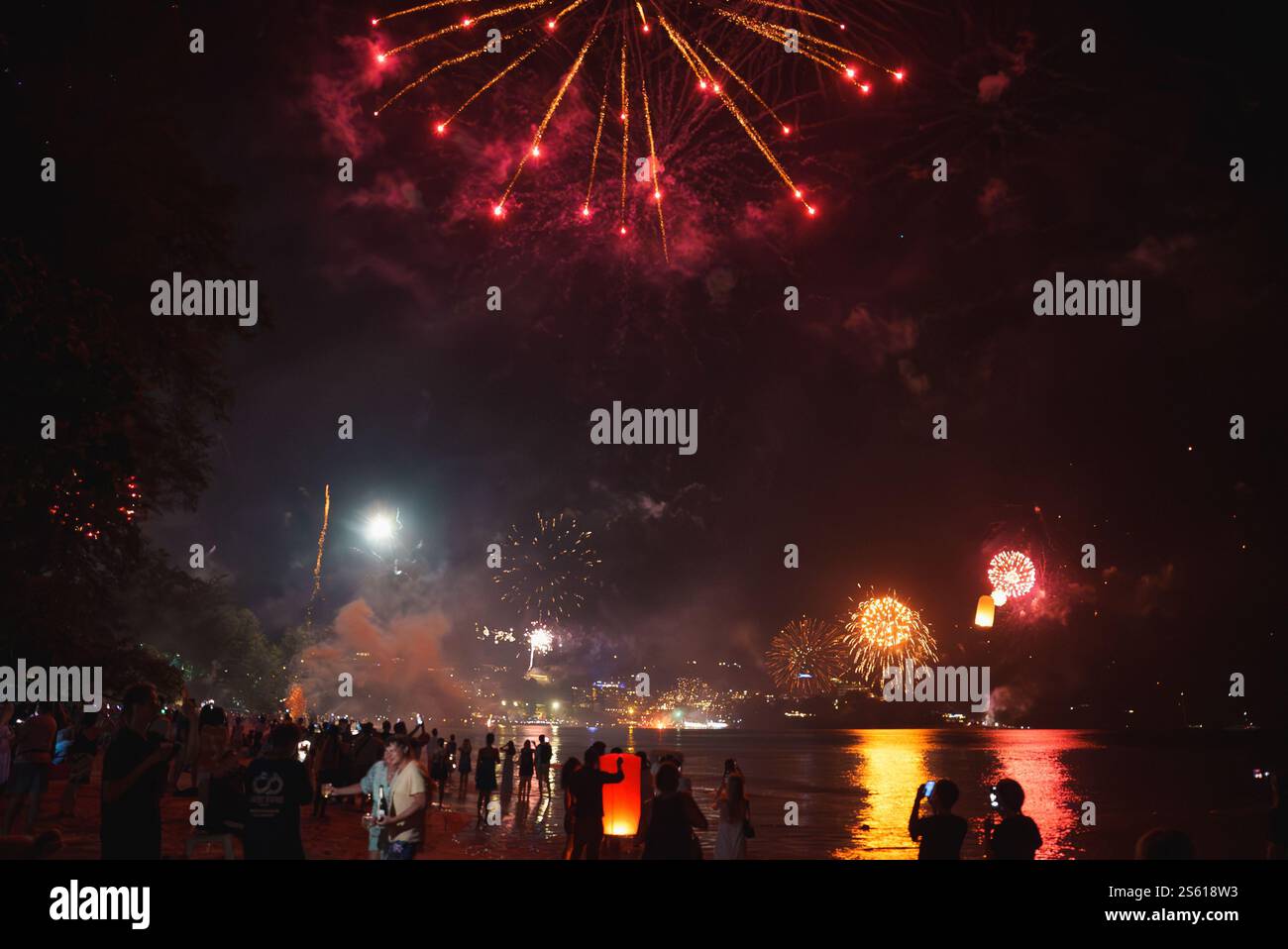 New Year's Fireworks and Lanterns on a Beach in Phuket, Thailand Stock ...