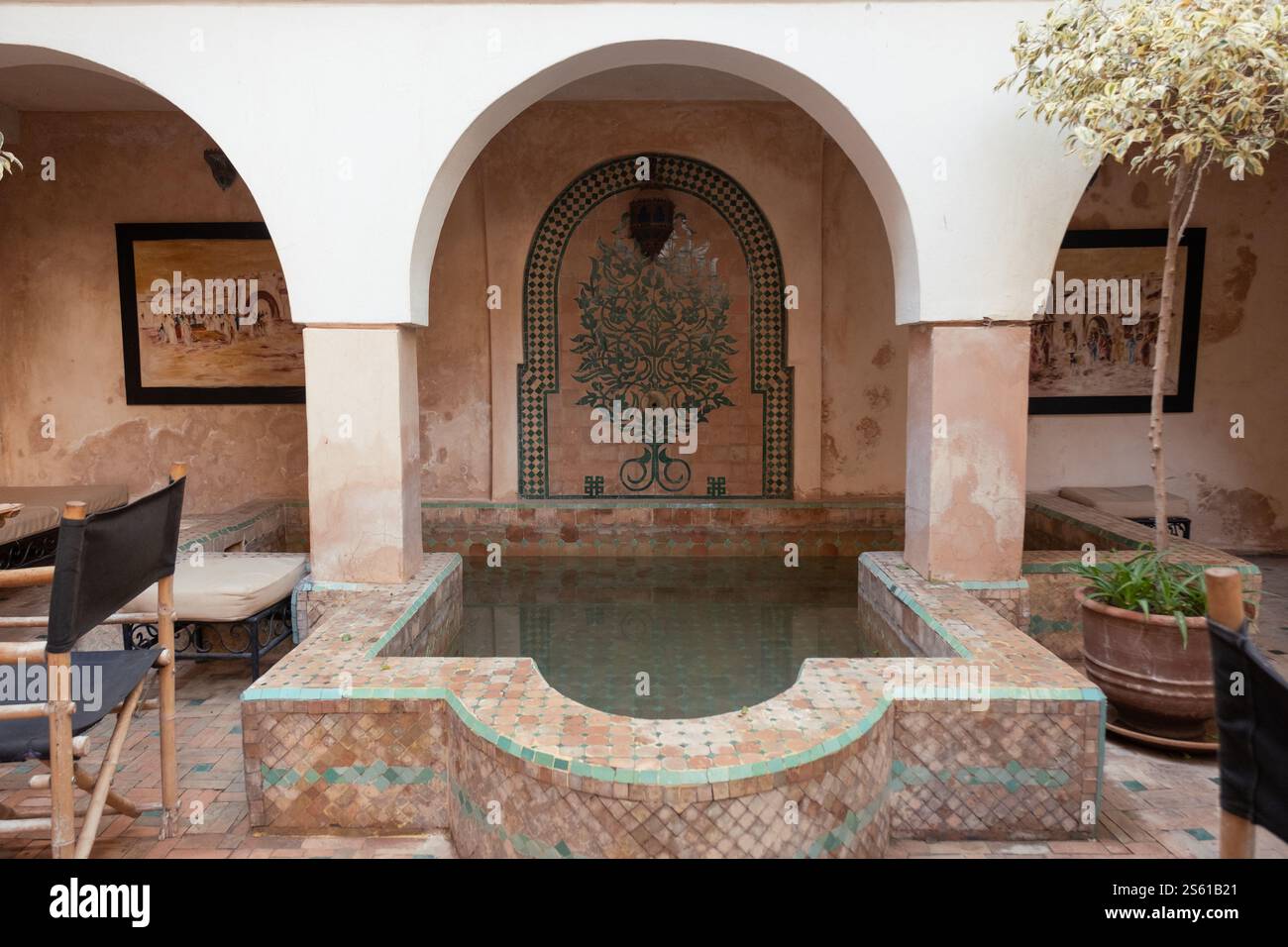Moroccan indoor bath or pools with moorish arches, arabic tiles and ...