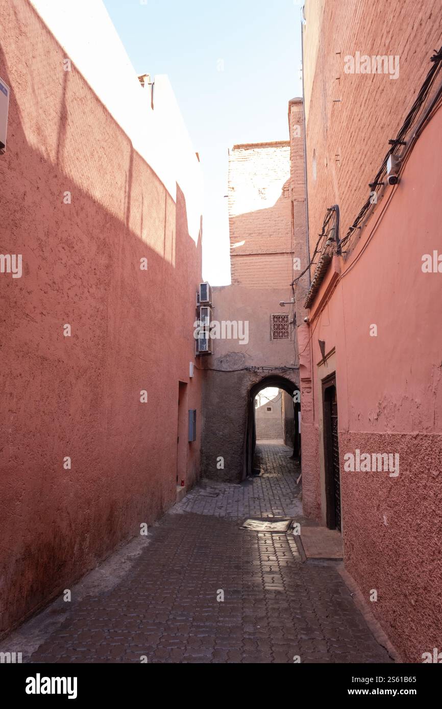 Street alley with pink walls inside the Marrakech Medina in Morocco ...