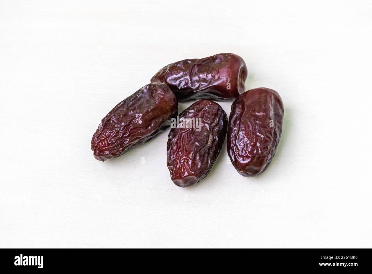 Fresh, dried dates are isolated against a white background Stock Photo ...