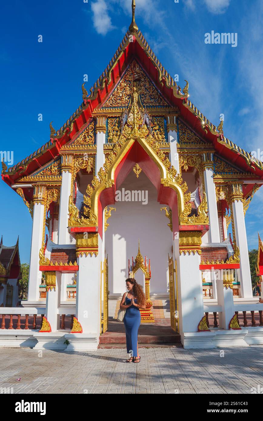 Woman in Blue Standing Before Ornate Thai Buddhist Temple in Sunlight ...