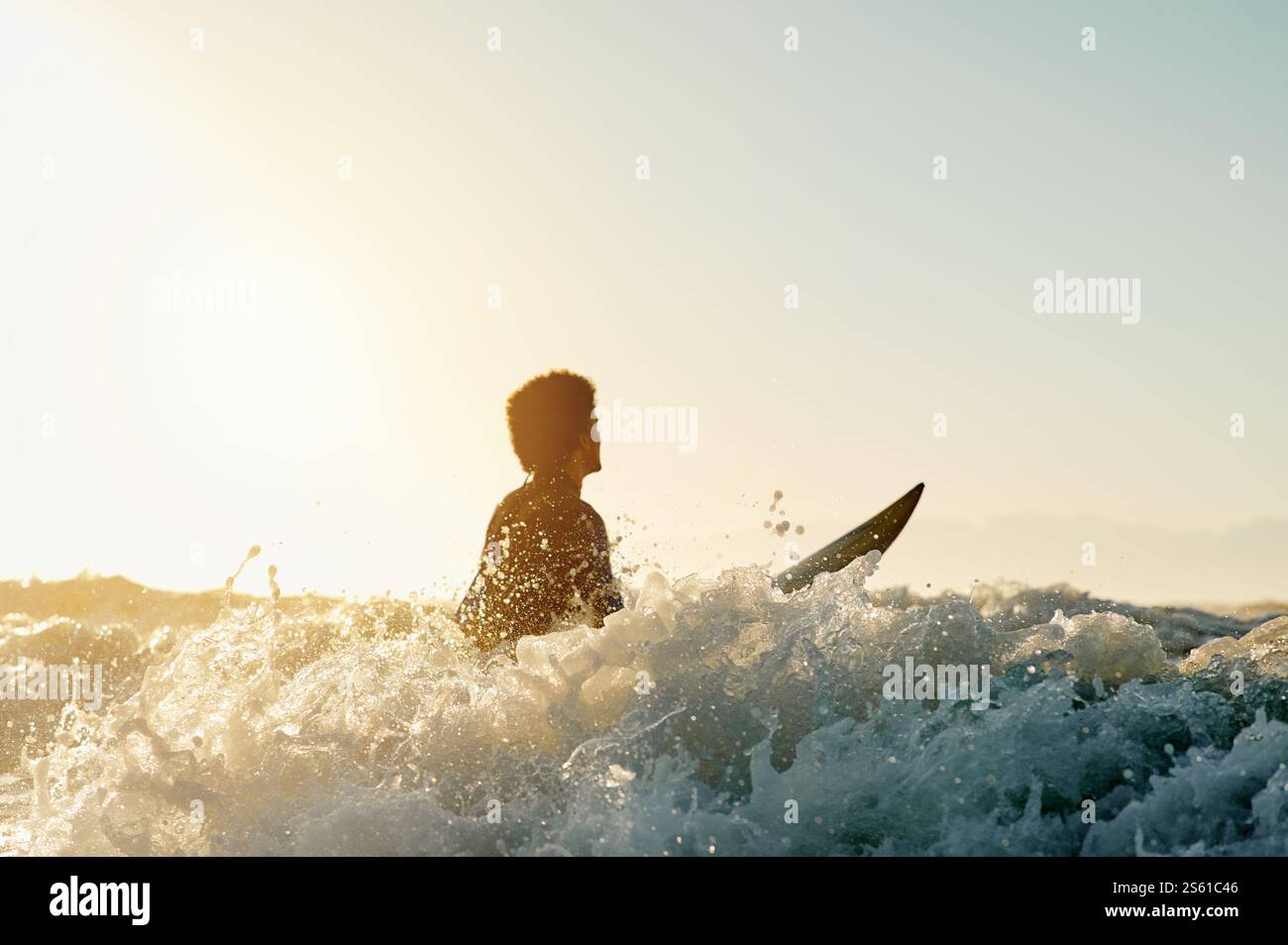 Surf, water splash and blue sky with a sports man in the ocean for ...