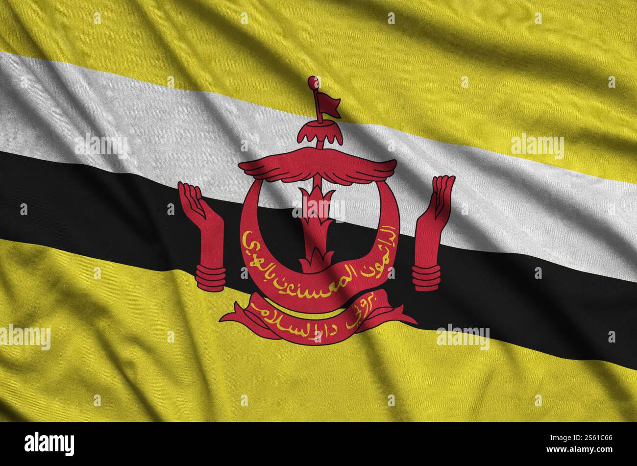 Brunei Darussalam flag is depicted on a sports cloth fabric with many ...