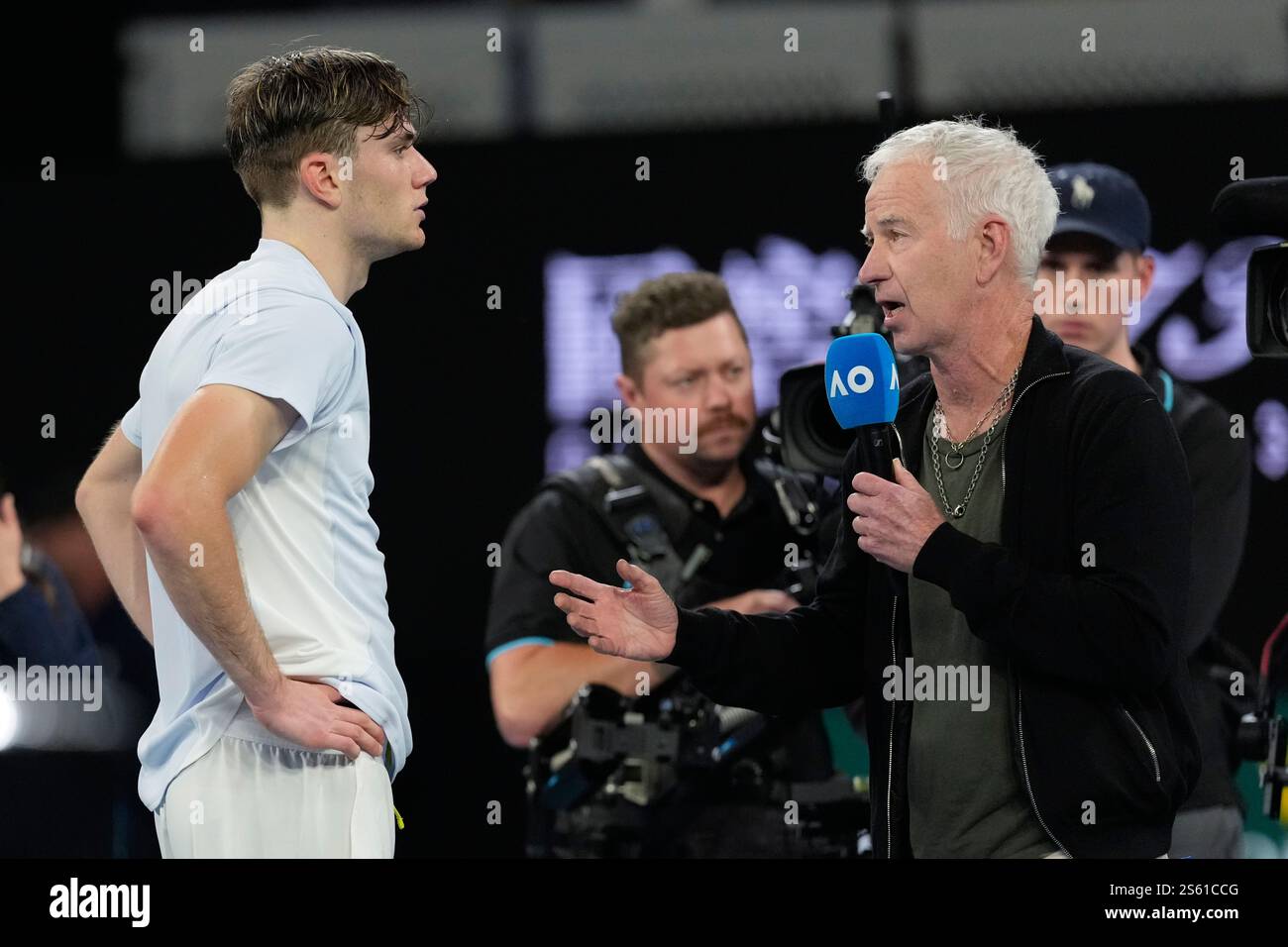 Jack Draper of Britain is interviewed by John McEnroe, right, after ...