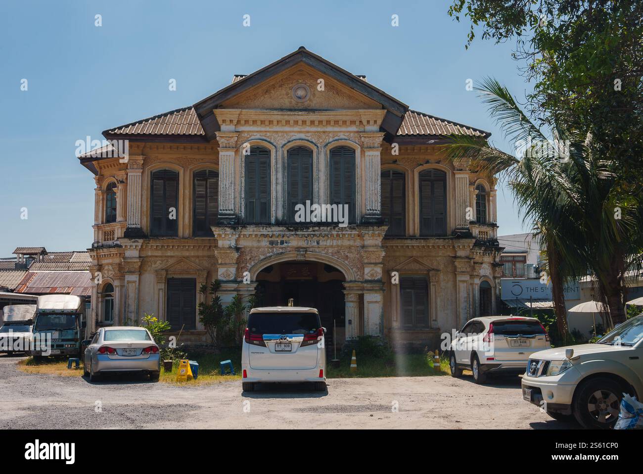 A weathered beige colonial style building in Phuket, Thailand ...