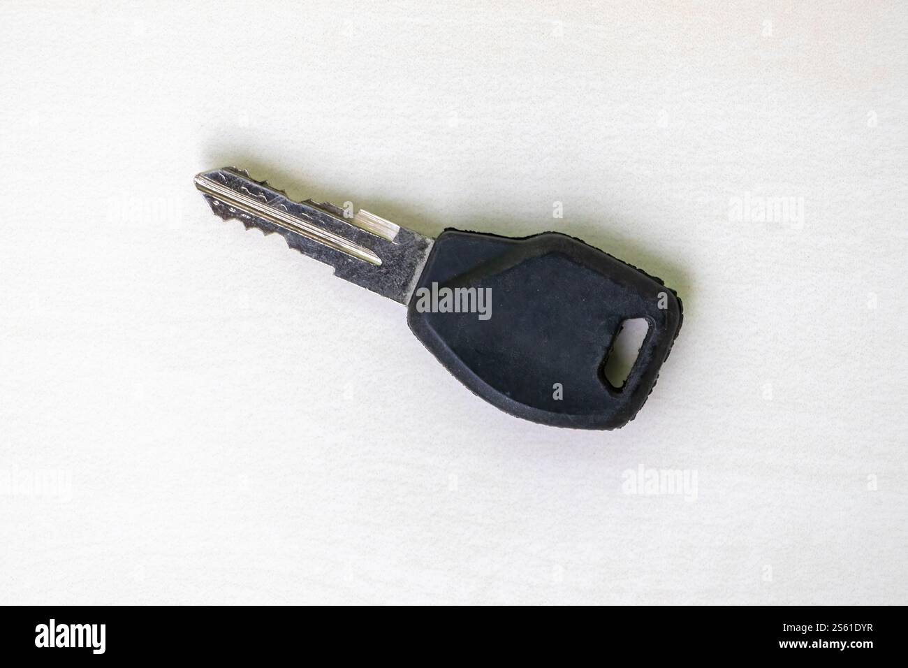 Black and silver key on a white background. Could be for a bike or car ...
