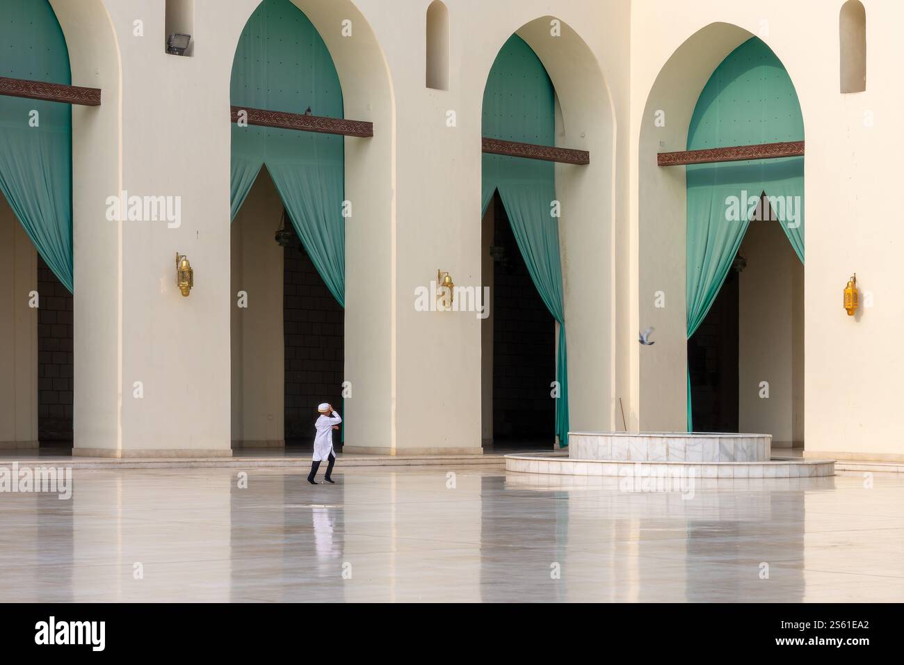 Boy running in the courtyard of Al Hakim mosque in the famous El Moez ...