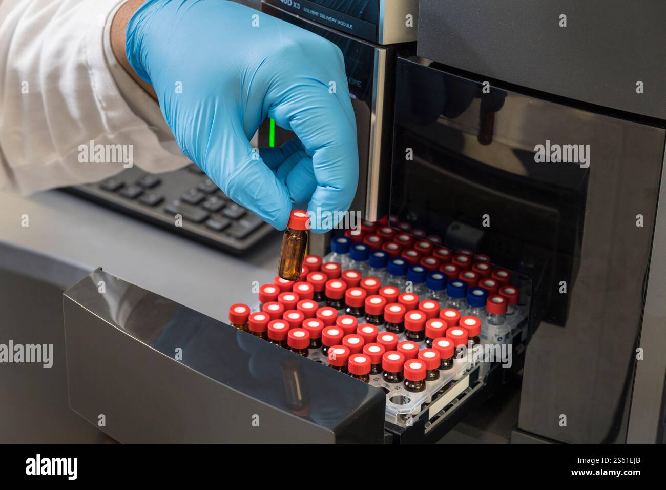Scientist holding vial in scientific testing lab laboratory, New Jersey ...