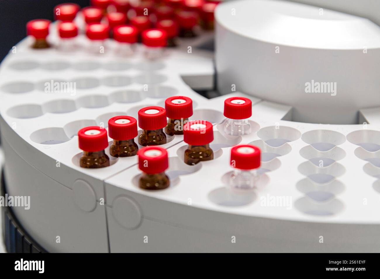 Vials in automated scientific testing equipment, USA Stock Photo - Alamy